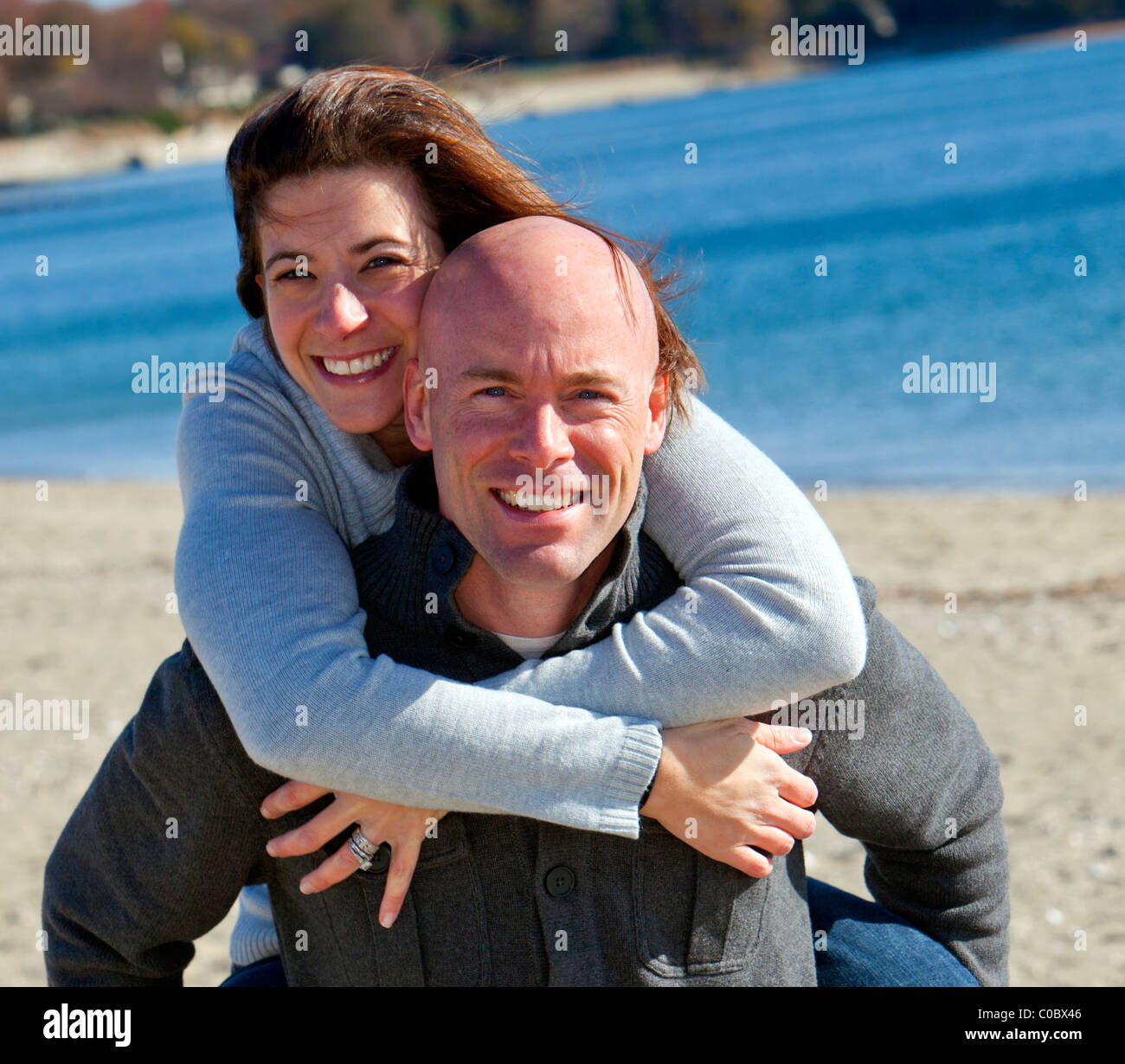 Good looking couple having fun at the beach Stock Photo - Alamy