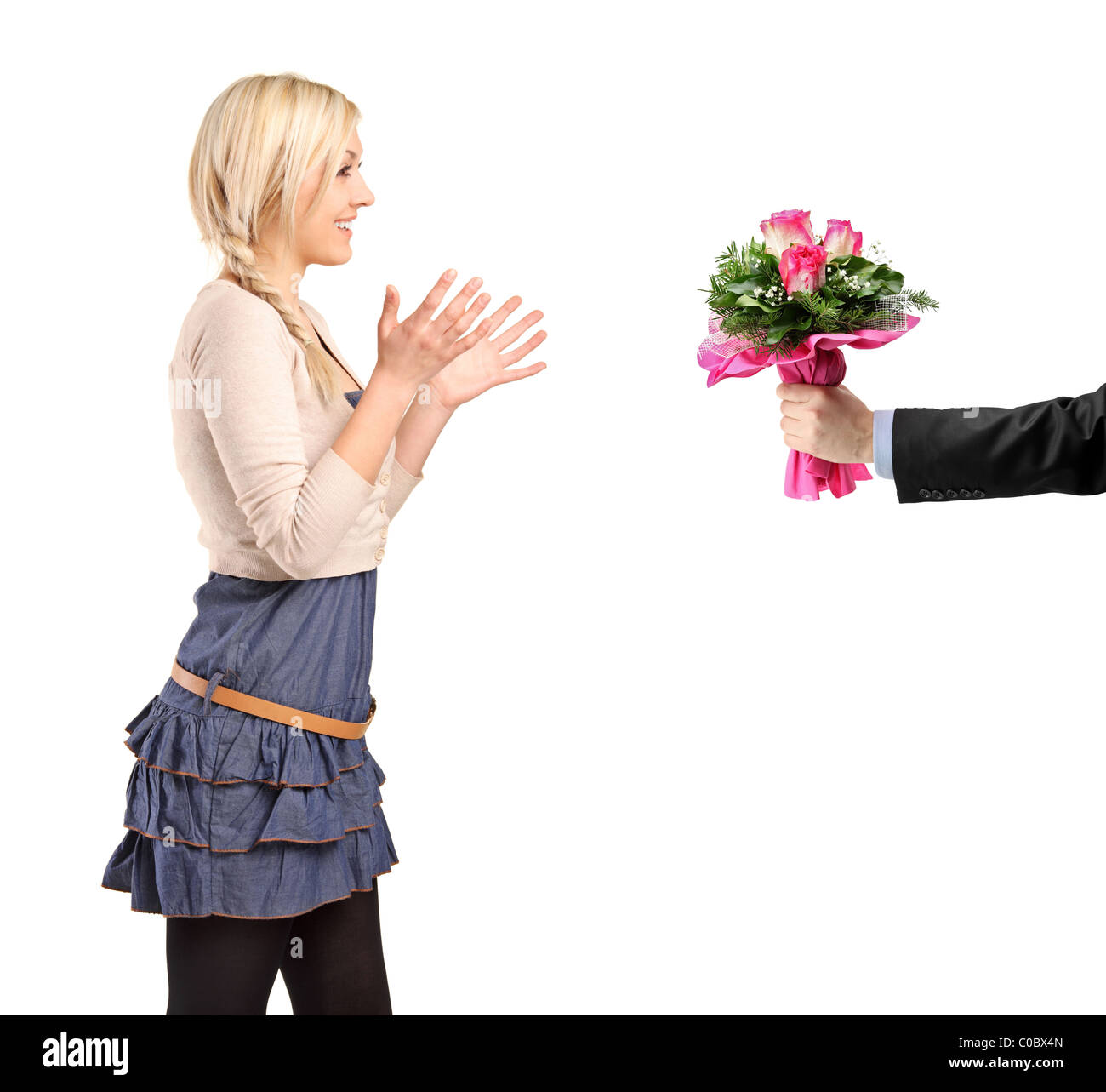 Surprised blond girl accepting bunch of flowers Stock Photo - Alamy