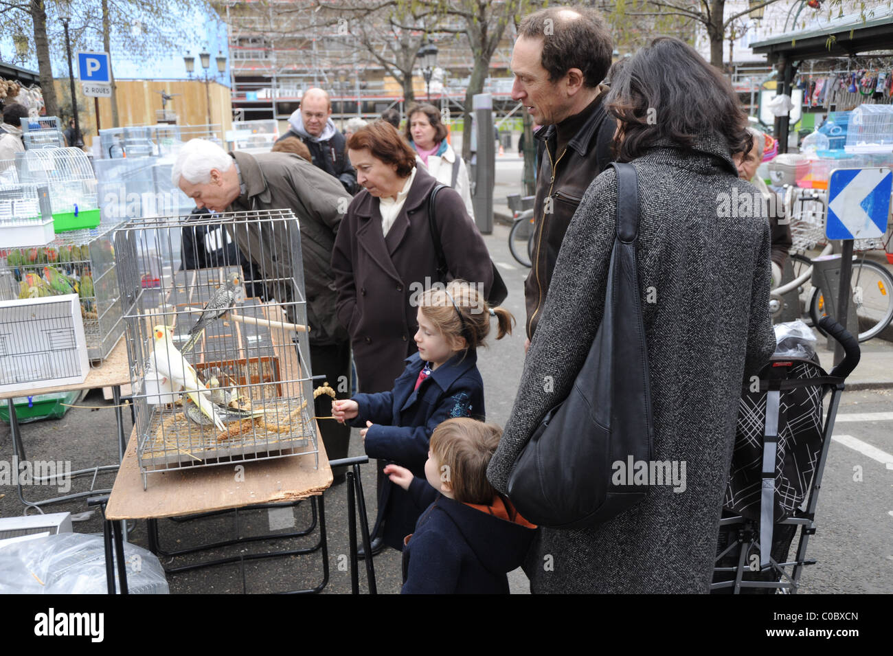 Paris, France - people visiting the birds market ( Marche aux oiseaux ...