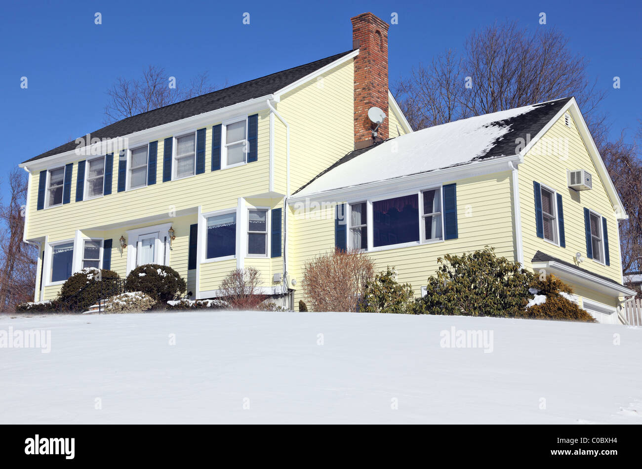 Traditional American colonial style house in winter Stock Photo - Alamy