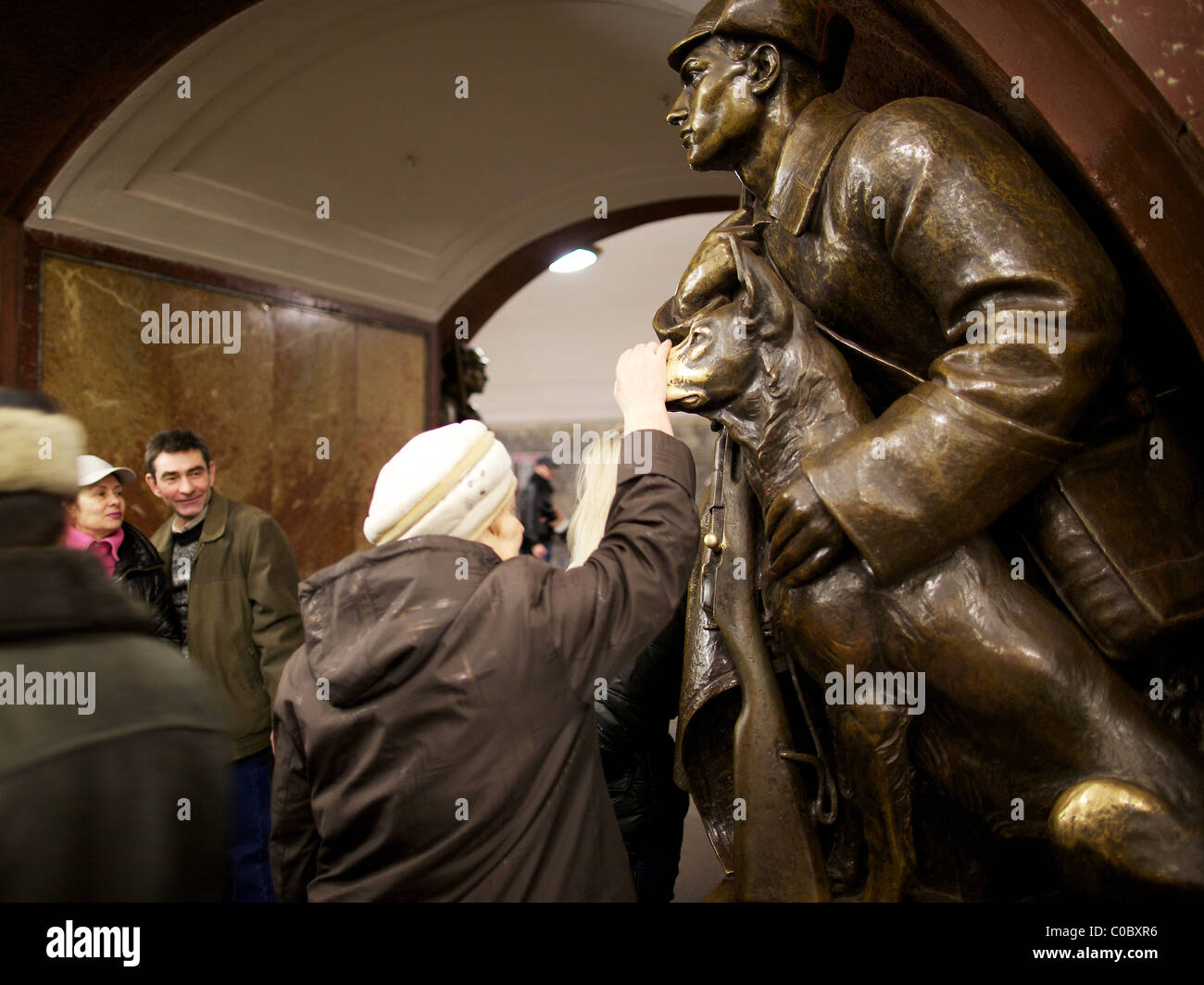Superstitious Muscovite touches for good luck the nose of a statue of a ...