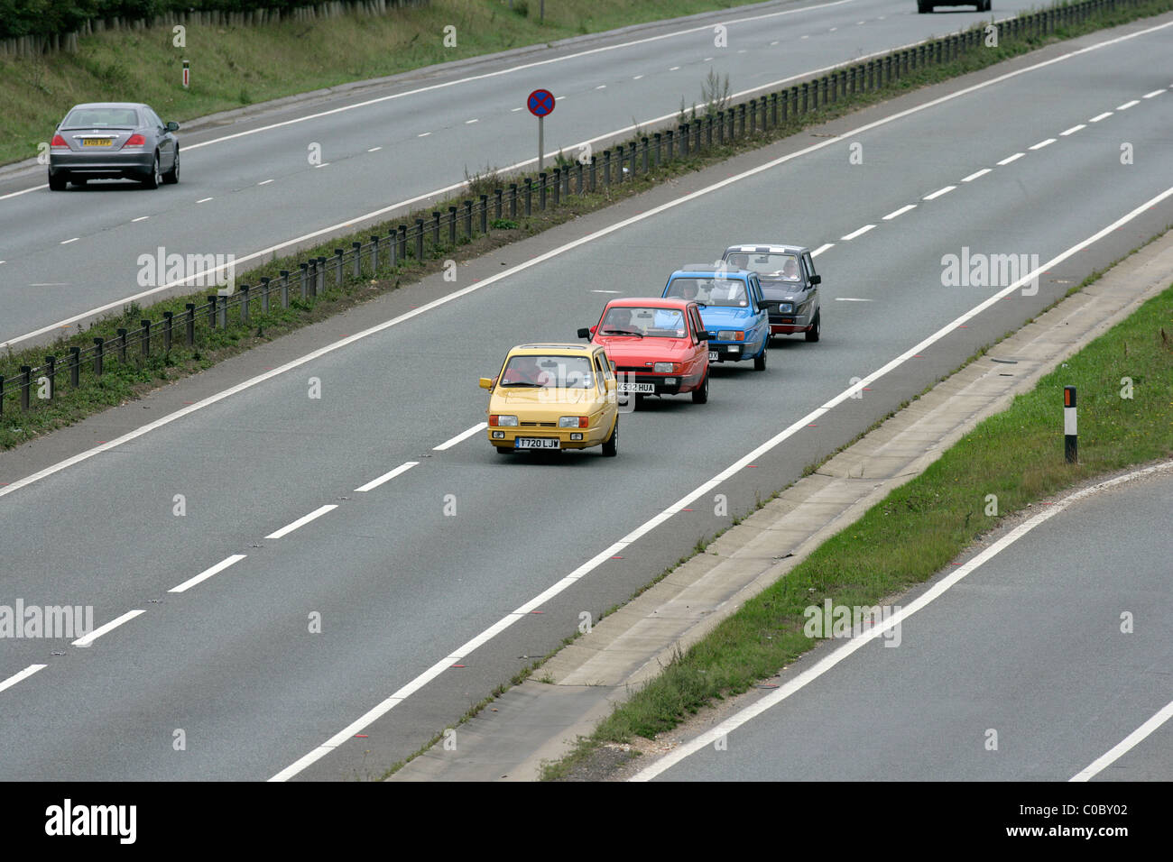 Four Reliant Robins driving in line Stock Photo - Alamy