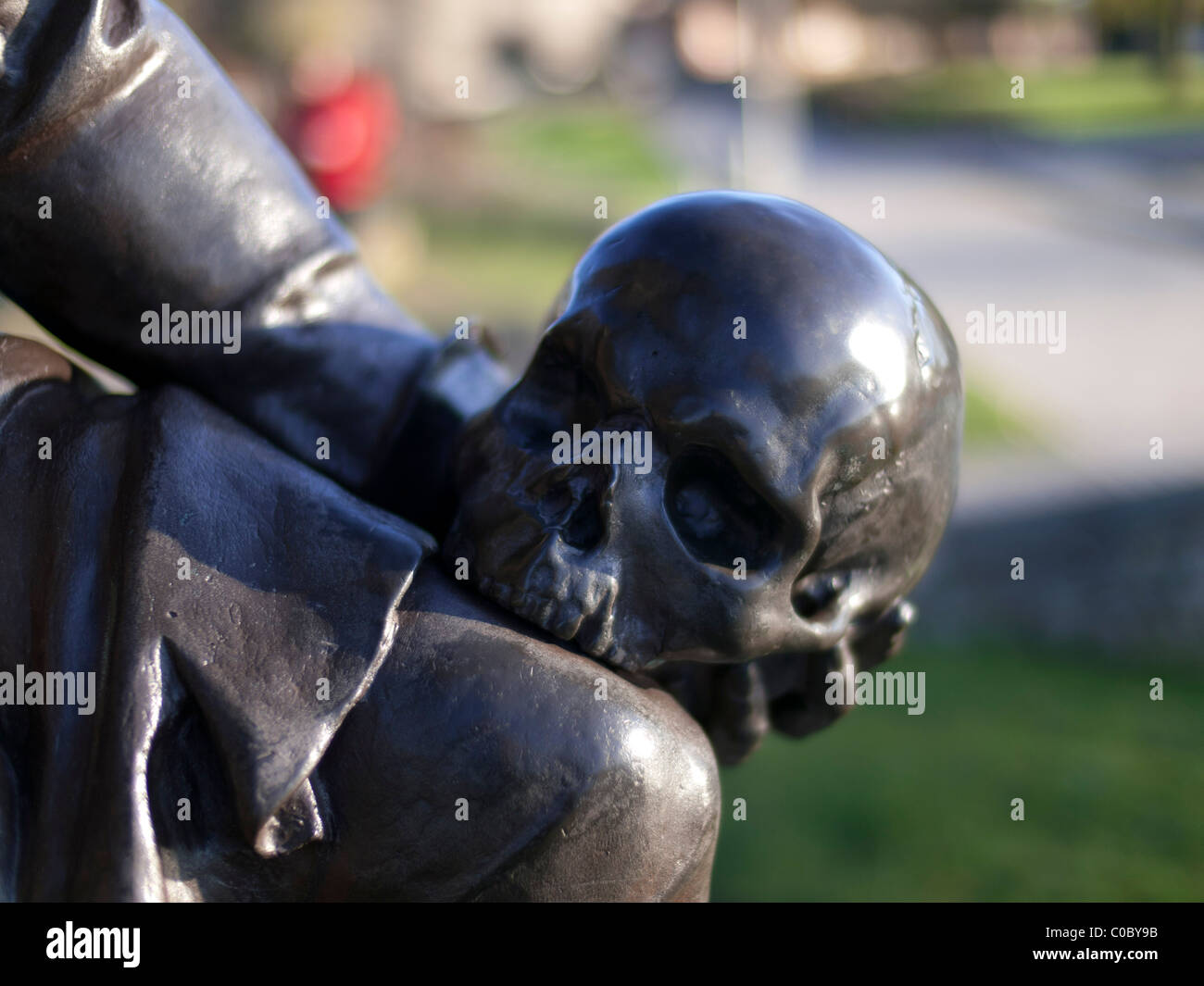 Statue of Hamlet with William Shakespeare behind Stratford upon Avon ...