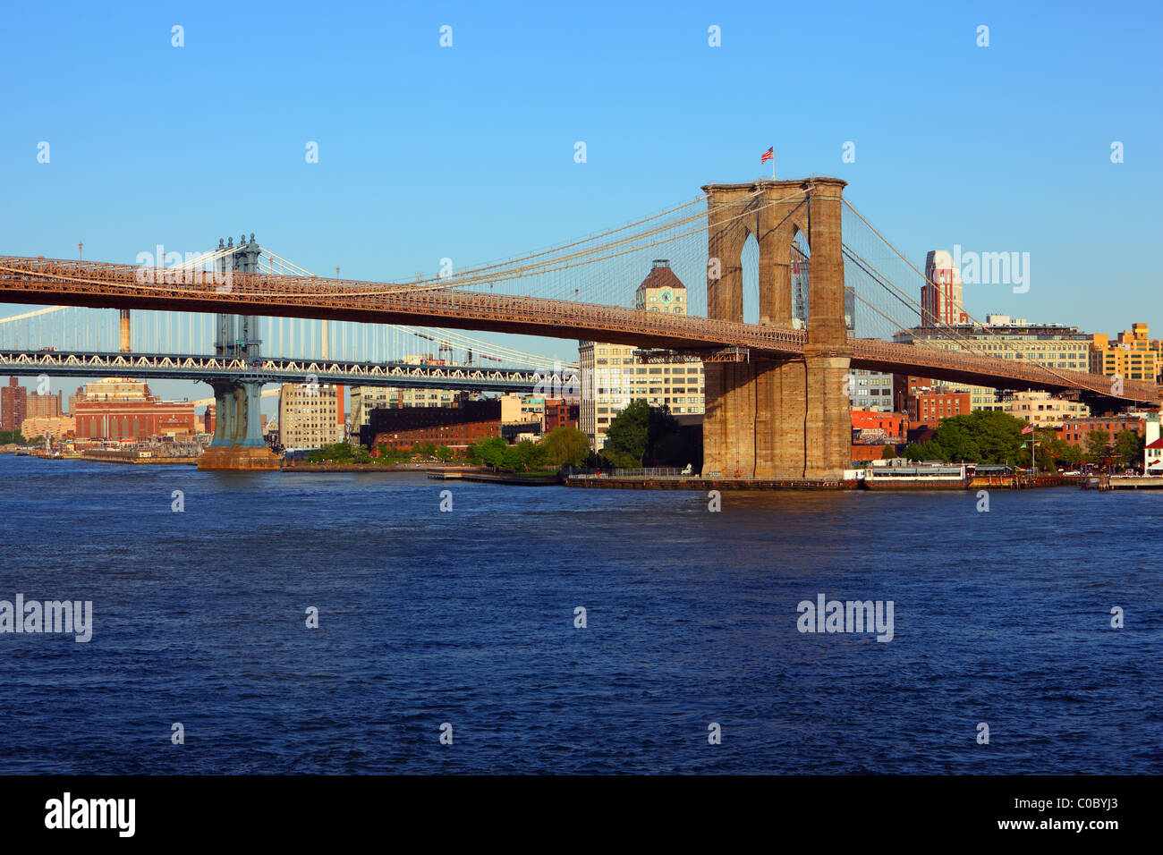 Brooklyn and Manhattan Bridges crossing the East river into new York ...