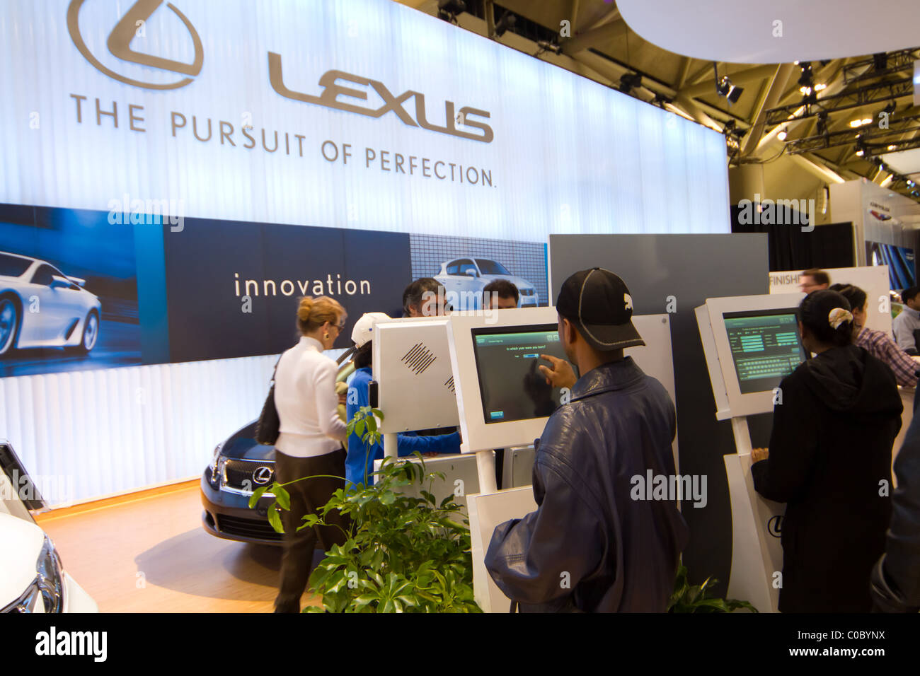 customer entering information lexus autoshow booth Stock Photo - Alamy