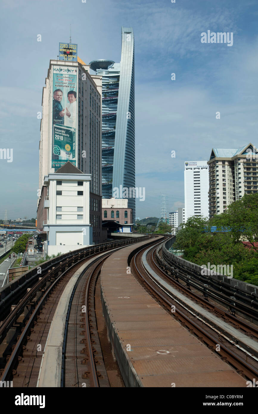 Office blocks and apartments stand beside the Light Rail Transit line ...