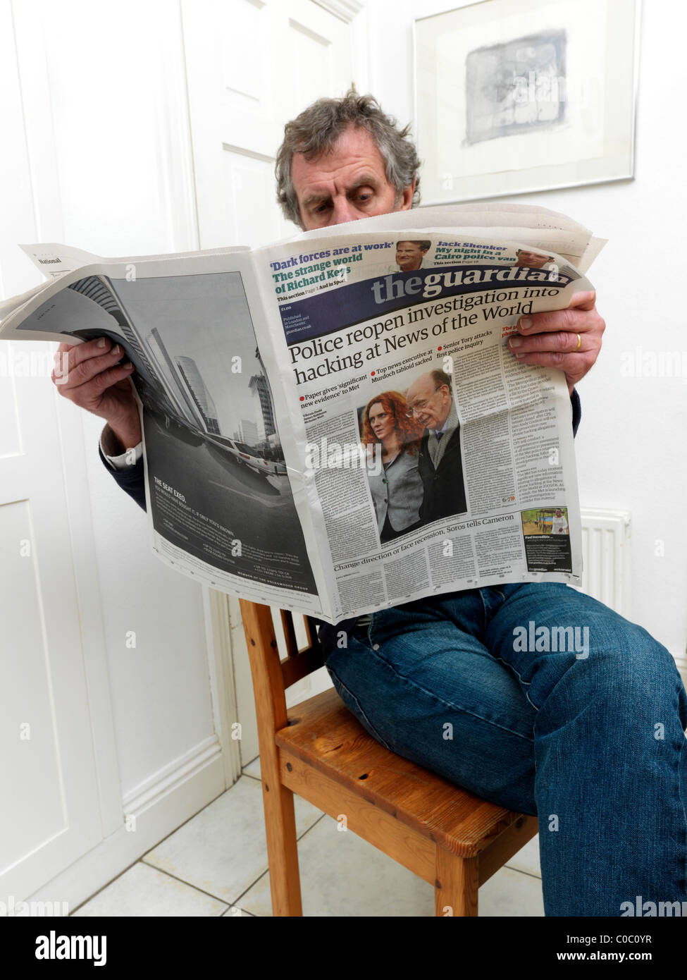 Reading The Guardian Newspaper High Resolution Stock Photography and ...