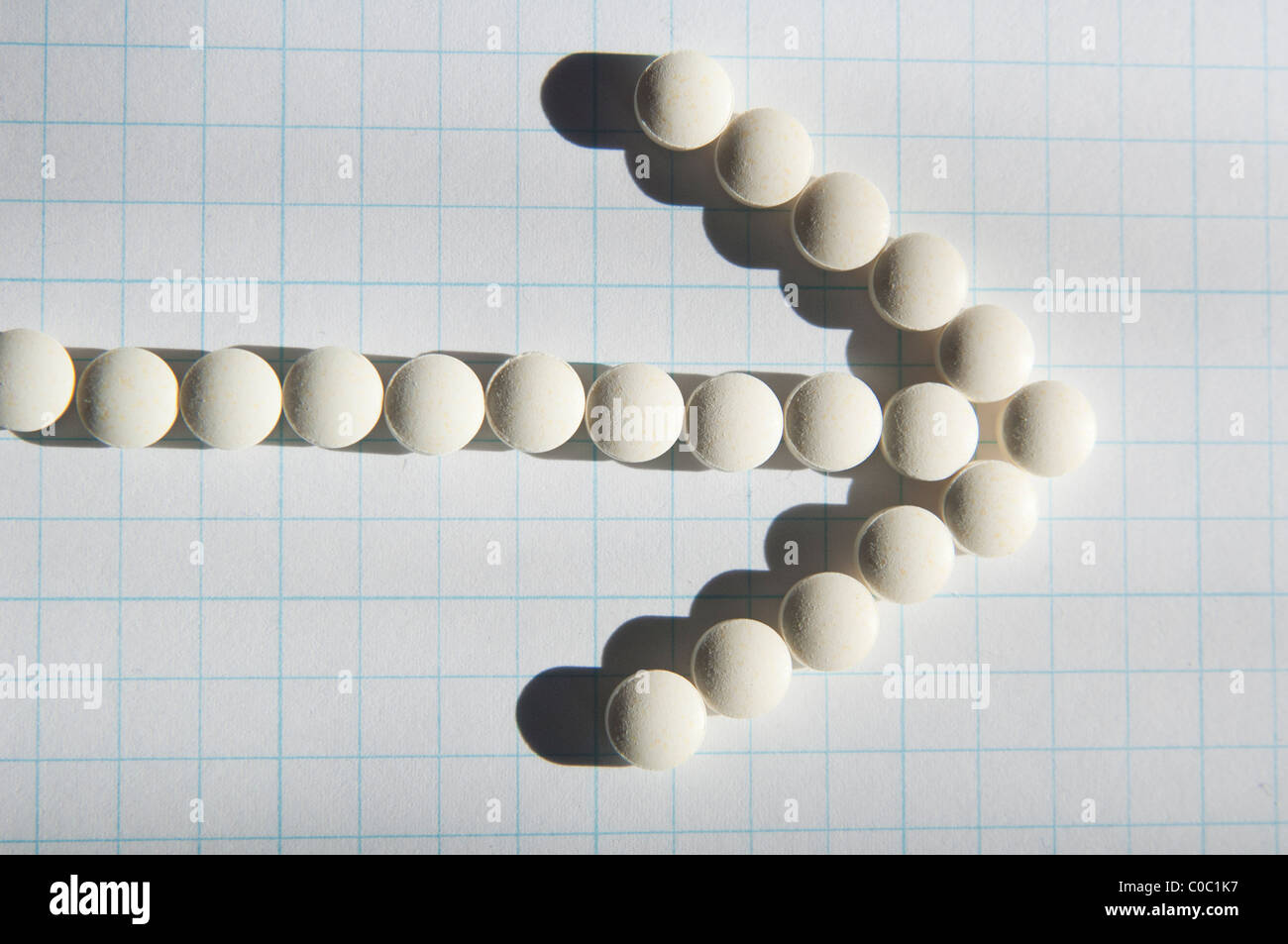 Pointer arrow made of pills Stock Photo - Alamy