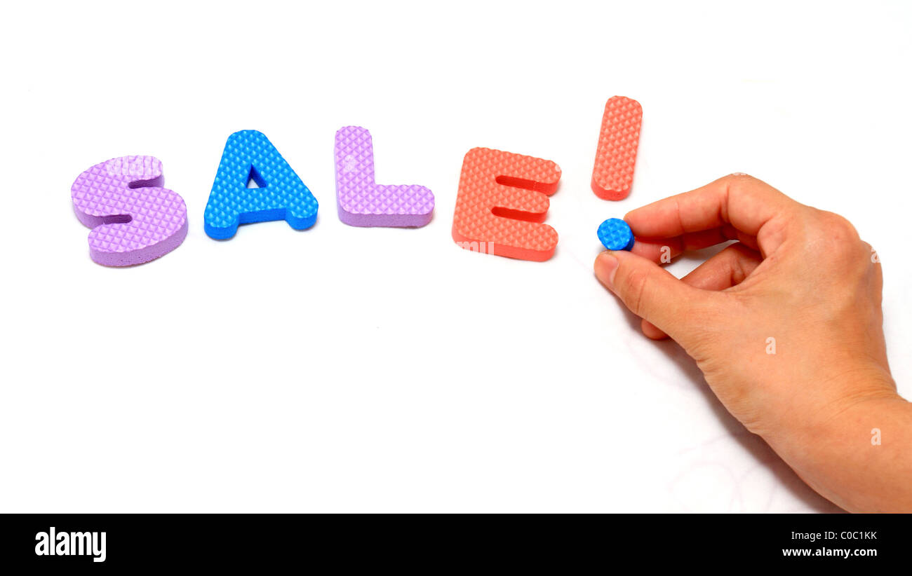 Hand with sales word isolated in white Stock Photo - Alamy