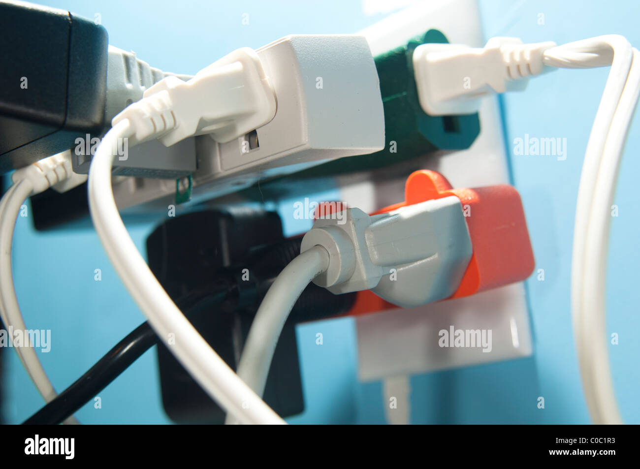 Overloaded electrical outlet Stock Photo - Alamy