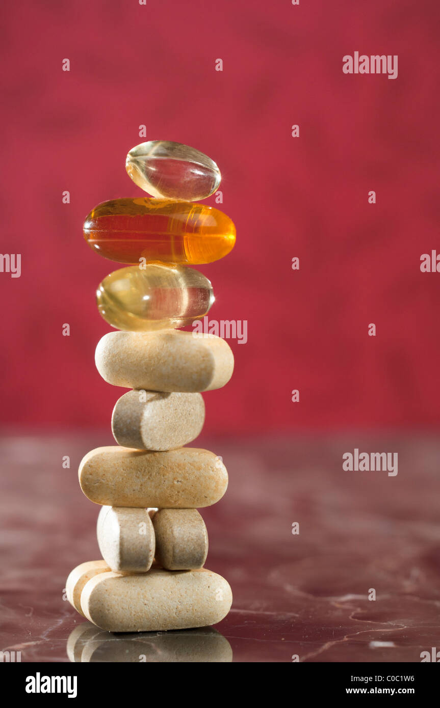 Balanced stack of dietary supplements Stock Photo - Alamy