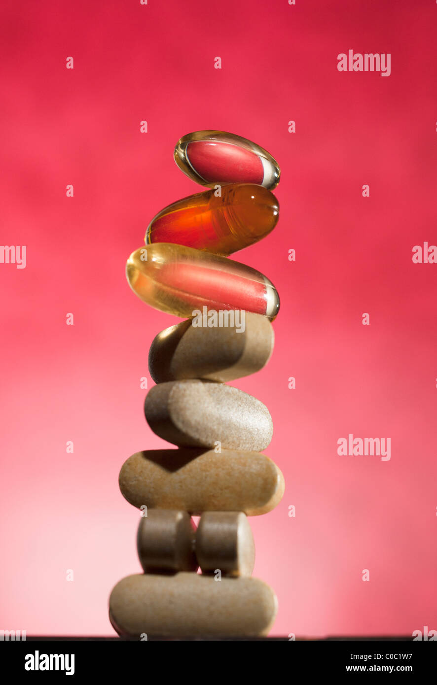 Balanced stack of dietary supplements Stock Photo - Alamy