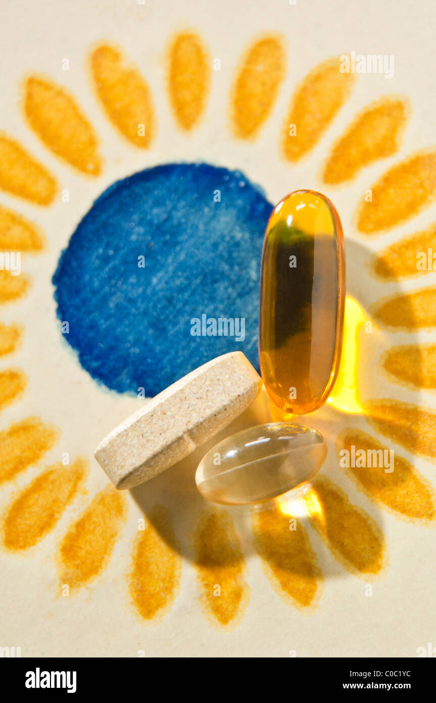 Nutritional supplements on a decorative tile with a sunshine motif ...