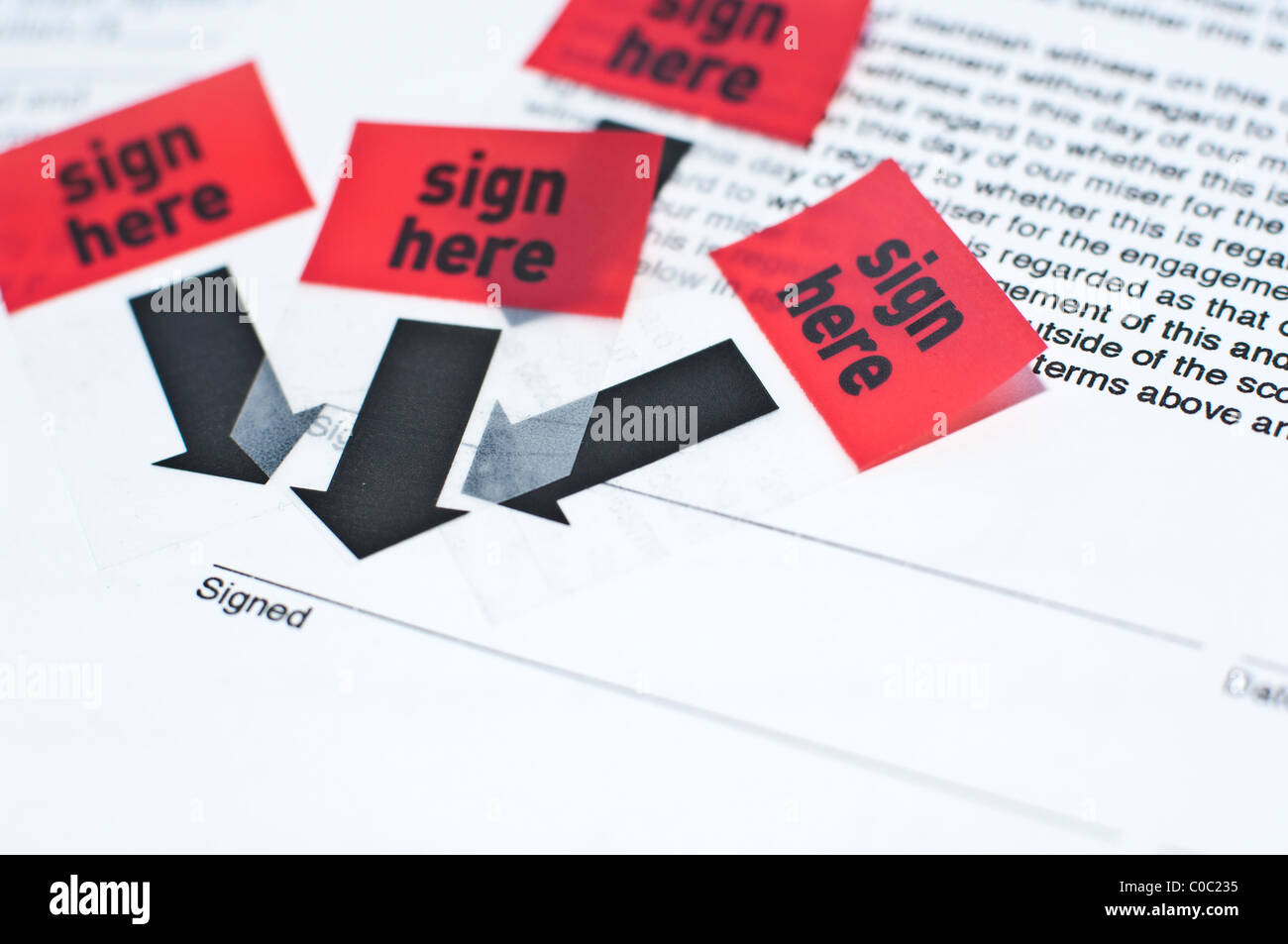 "Sign here" stickers on a contract Stock Photo - Alamy