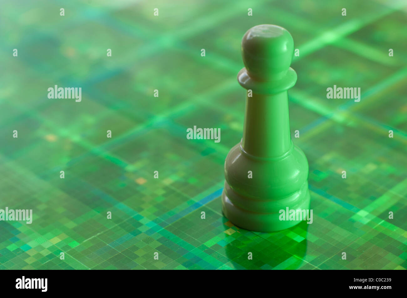 Lone chess pawn in green coloring Stock Photo - Alamy