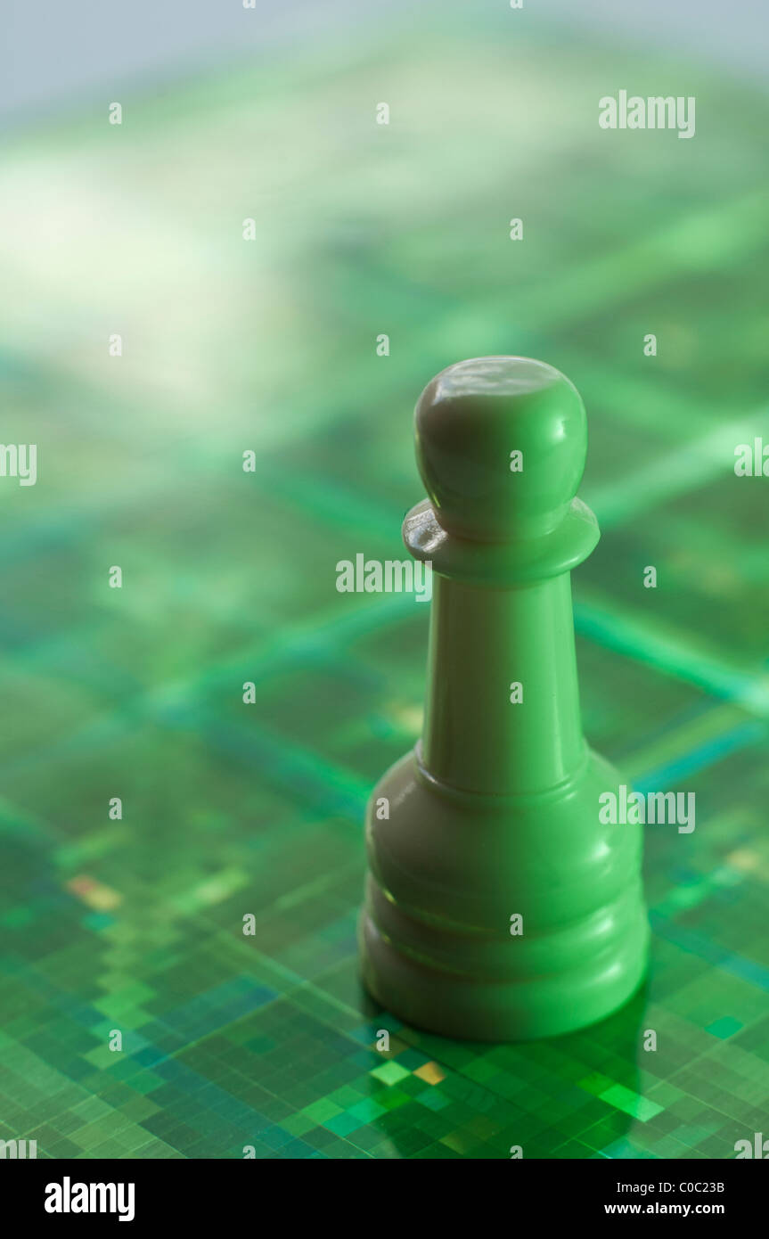Lone chess pawn in green coloring Stock Photo - Alamy