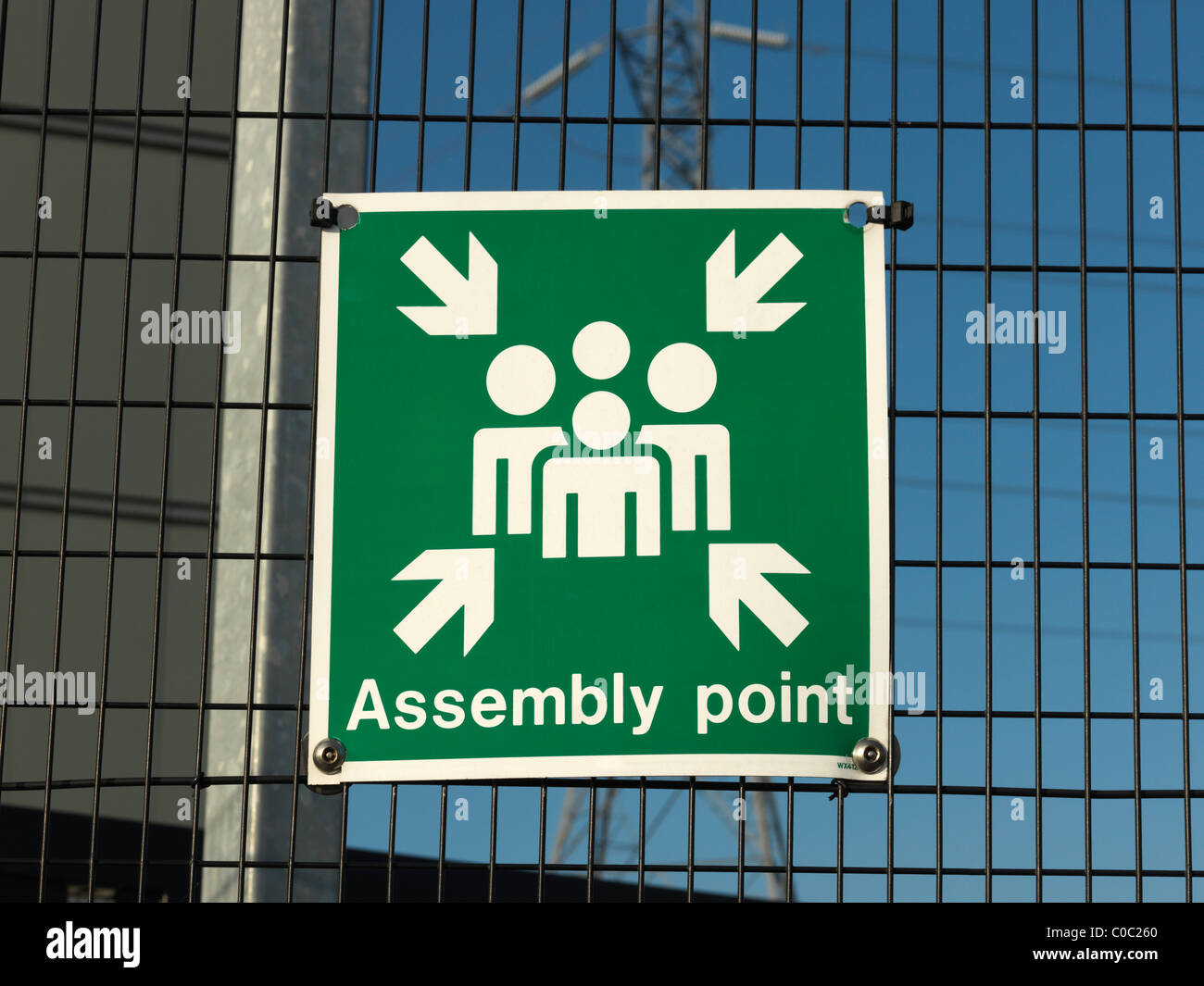 Assembly Point Sign On Security Gate Stock Photo - Alamy
