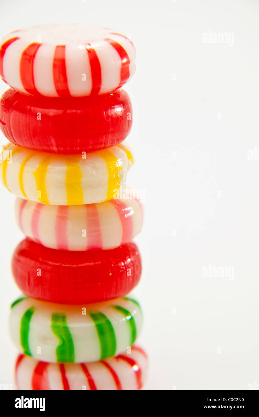 Colourful candies in a balanced stack Stock Photo - Alamy