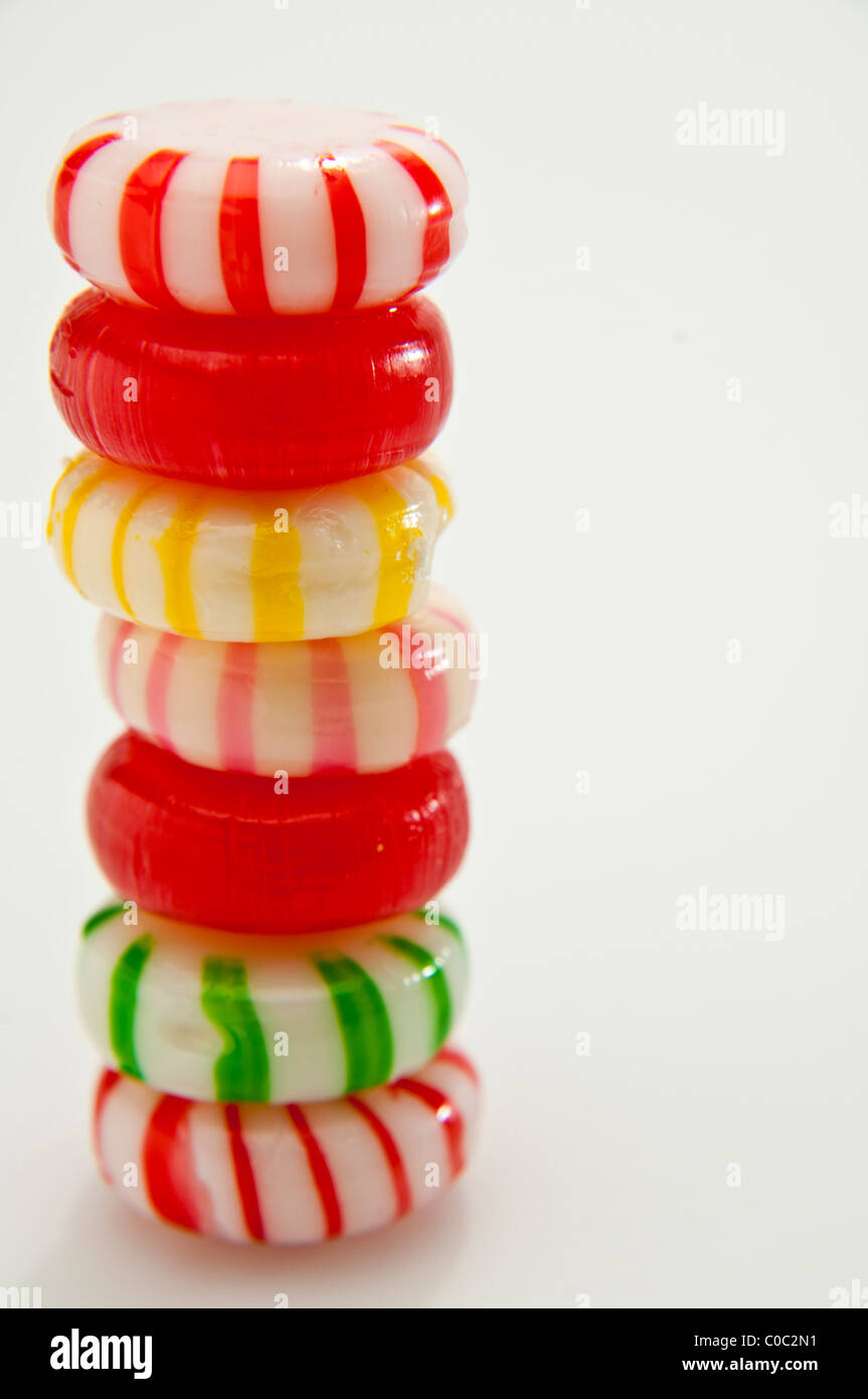 Colourful candies in a balanced stack Stock Photo - Alamy