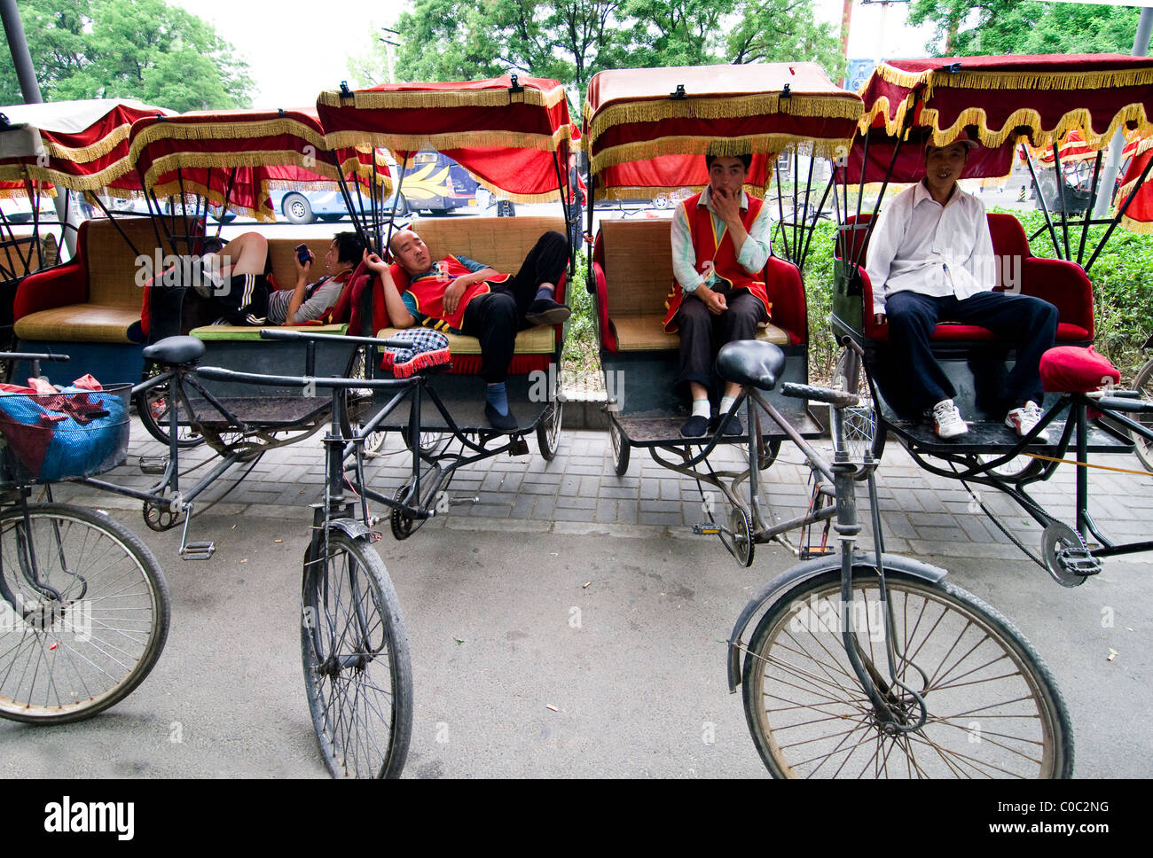 Resting on their cycle rickshaws in Beijing Stock Photo - Alamy