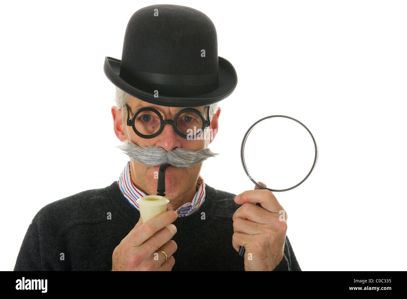 Portrait of a funny inspector with a big magnifier for investigation ...