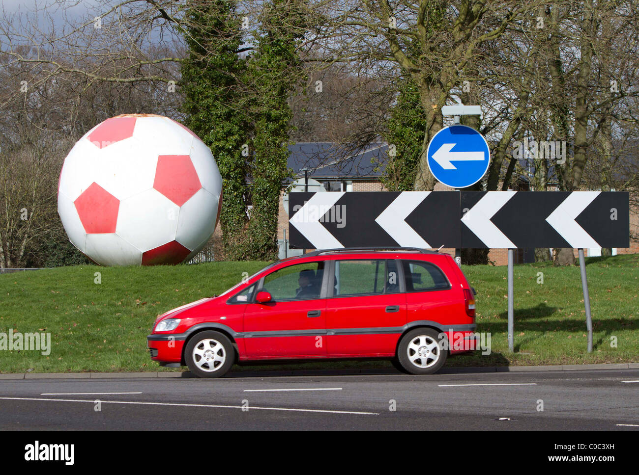 A giant football on a traffic roundabout in Crawley, West Sussex ...