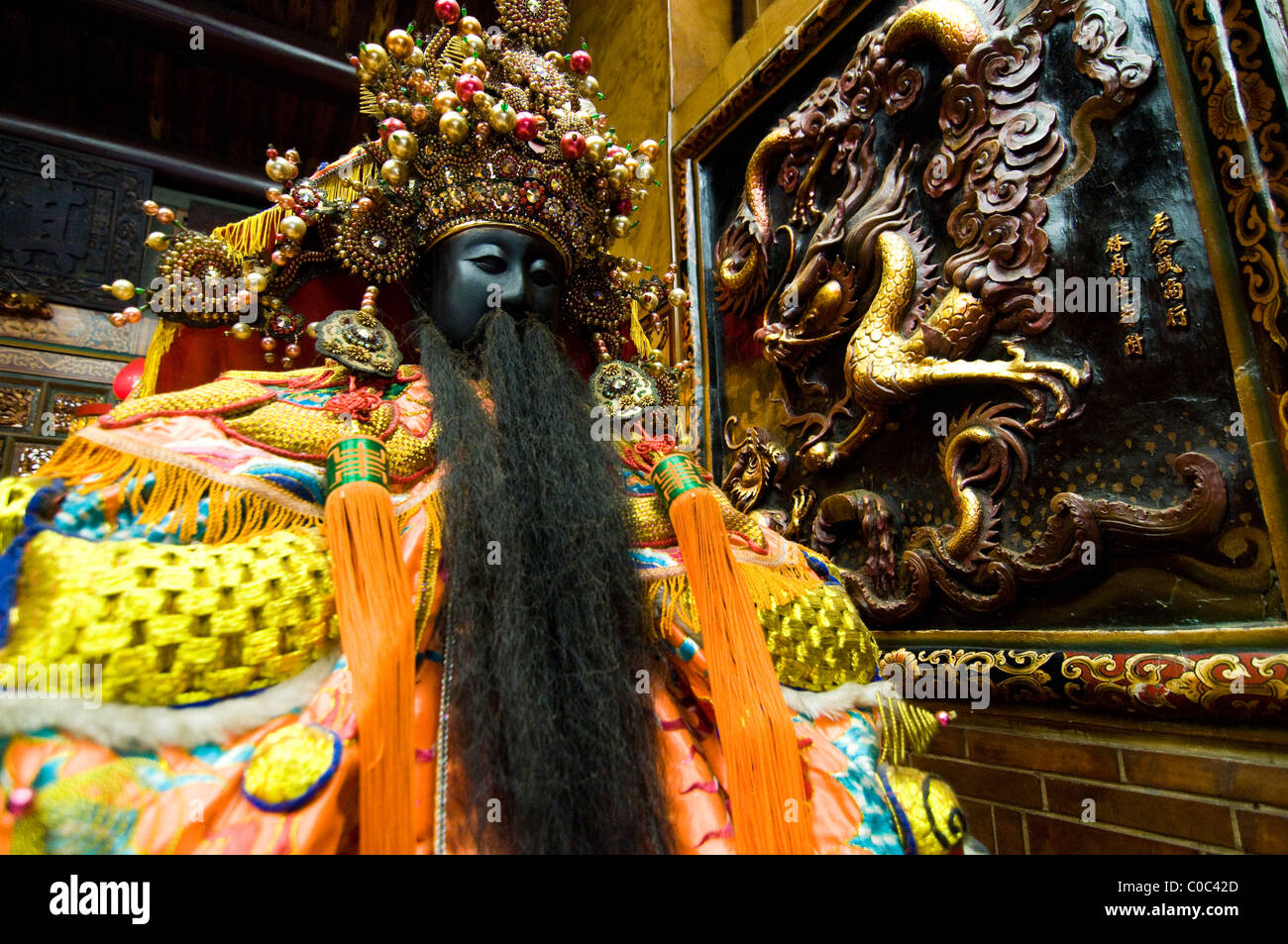 A colorful Taoist figure Inside a colorful Taoist temple in the old ...