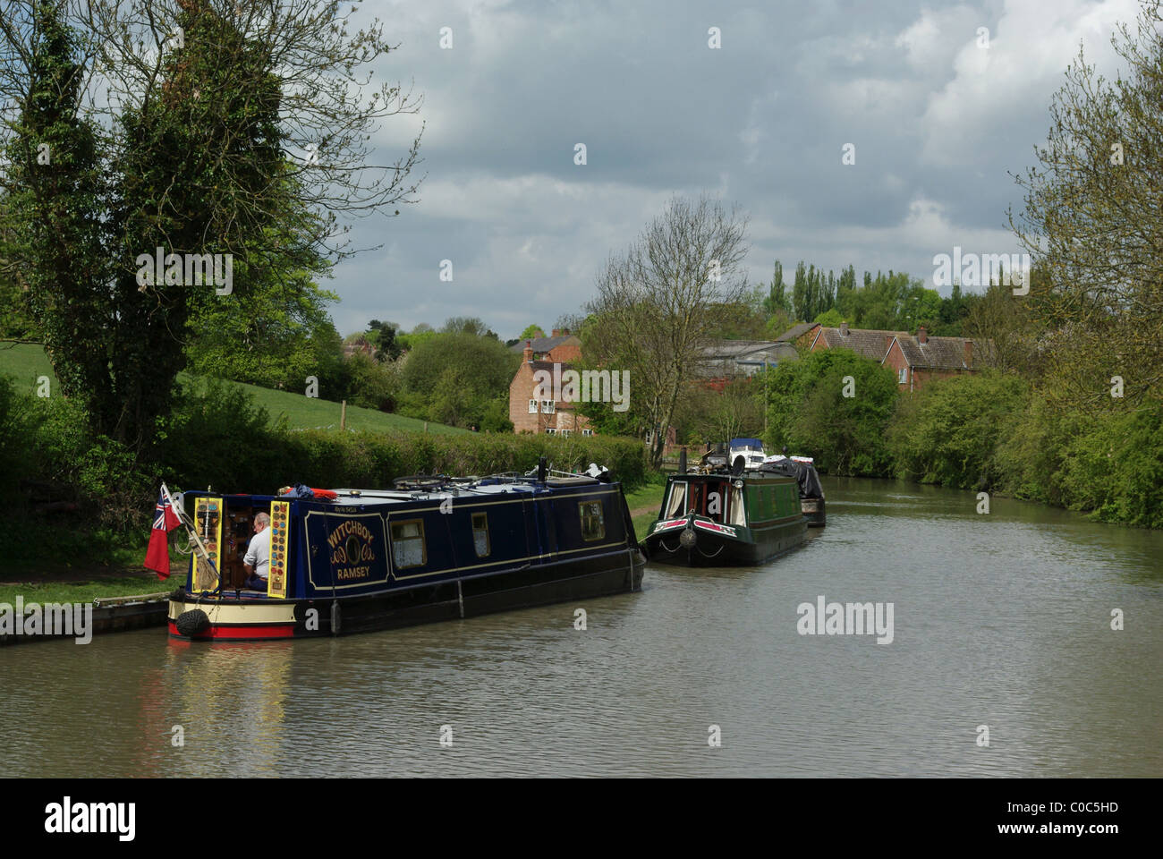 Two narrowboats on a stretch of the Grand Union Canal at Braunston ...