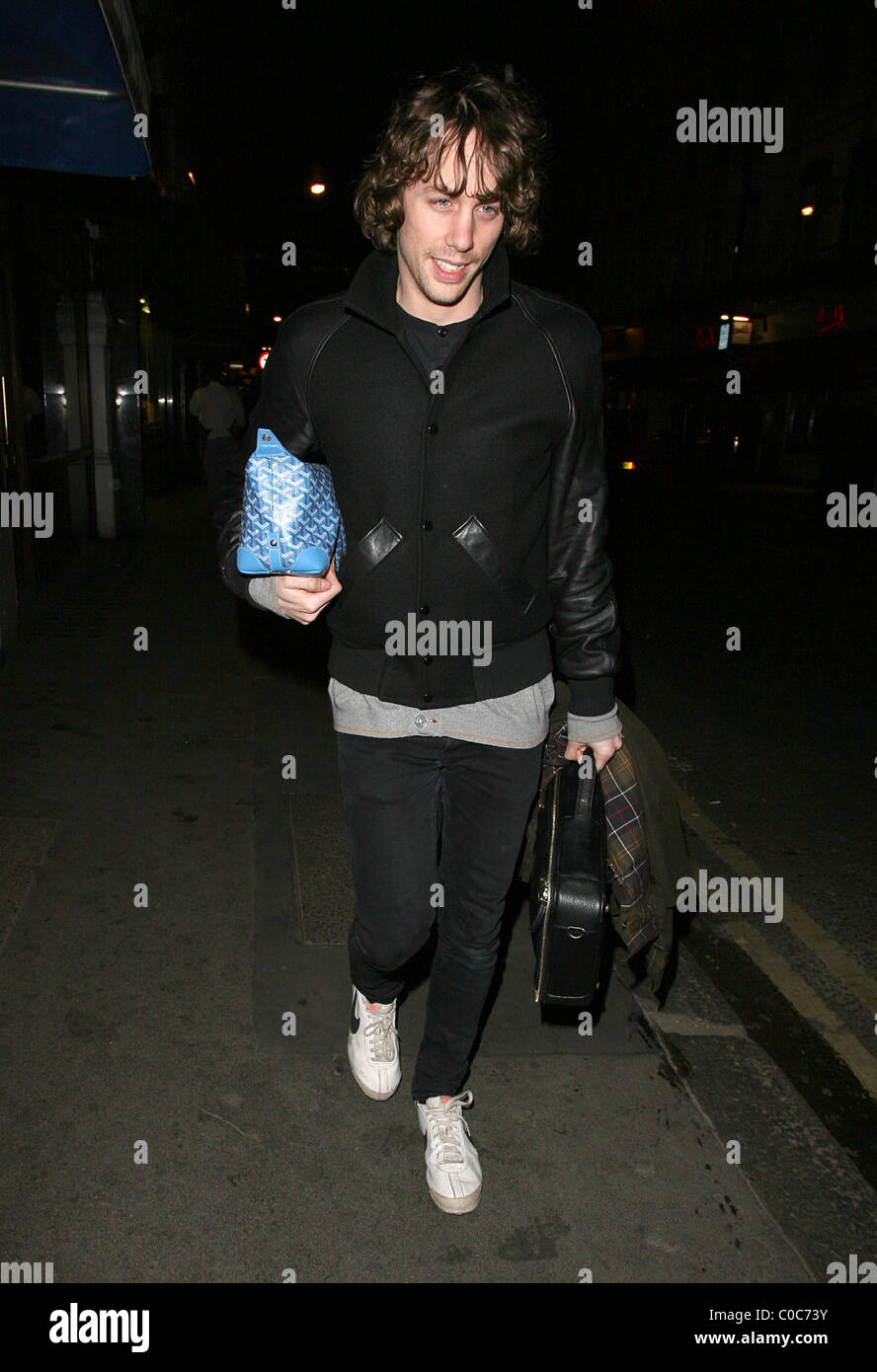 Johnny Borrell looks embarrassed as he leaves Balans restaurant in Soho ...