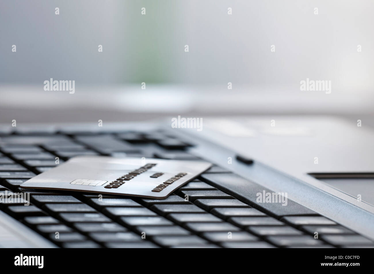 Credit Card Over a laptop keyboard Stock Photo - Alamy