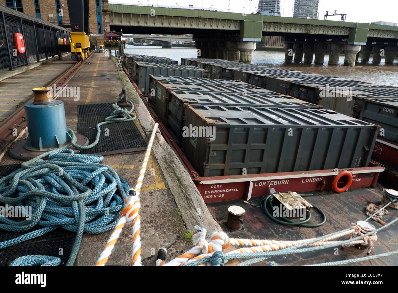 Barges carrying environmental waste management containers at Walbrook ...