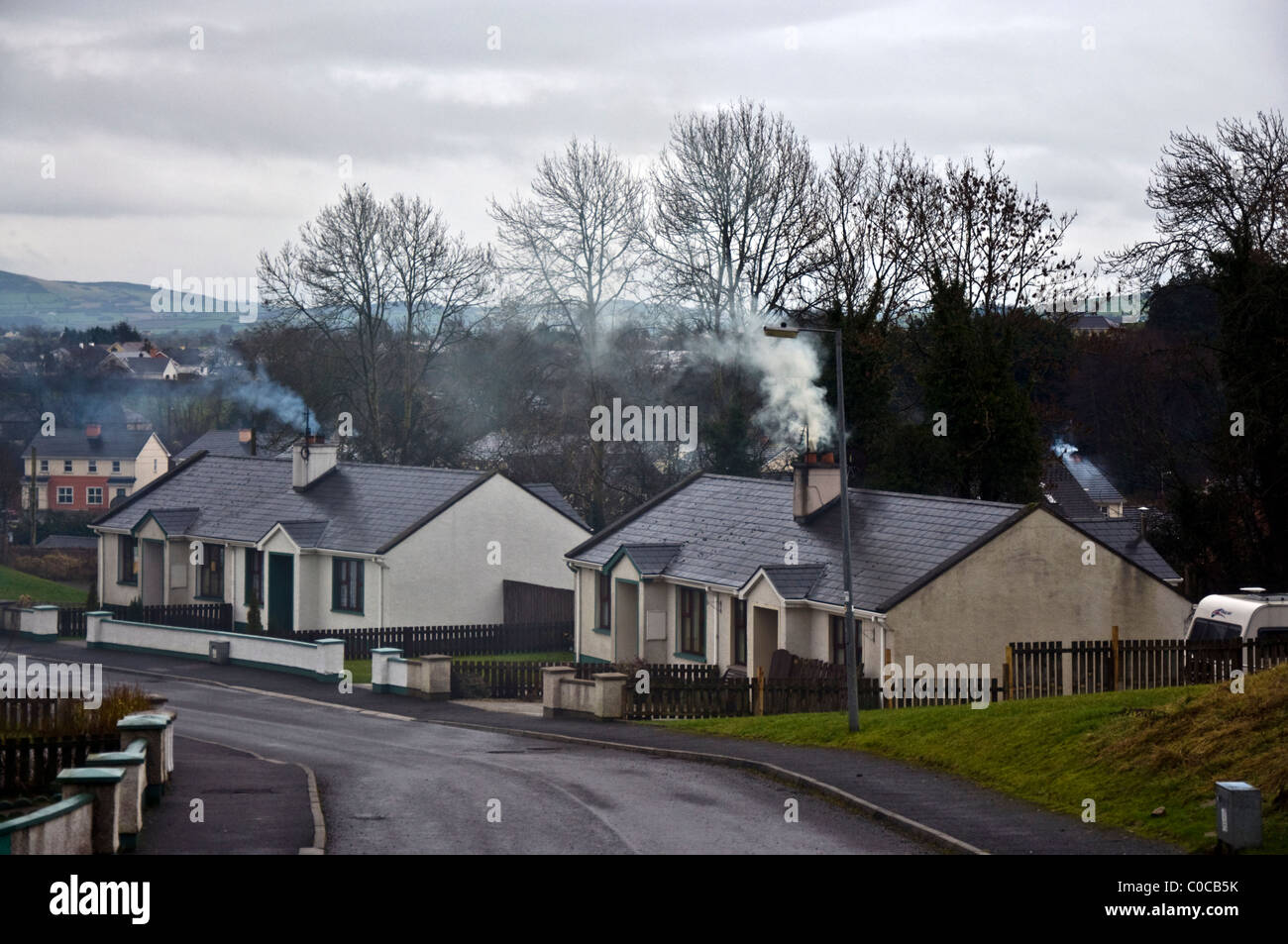 Houses burning fossil fuel Stock Photo - Alamy