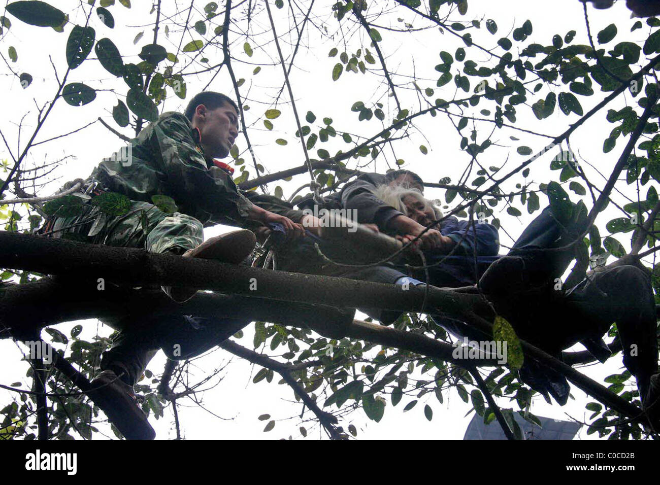 * RESCUE ATTEMPT Firefighters in China have rescued a 70-year-old woman ...