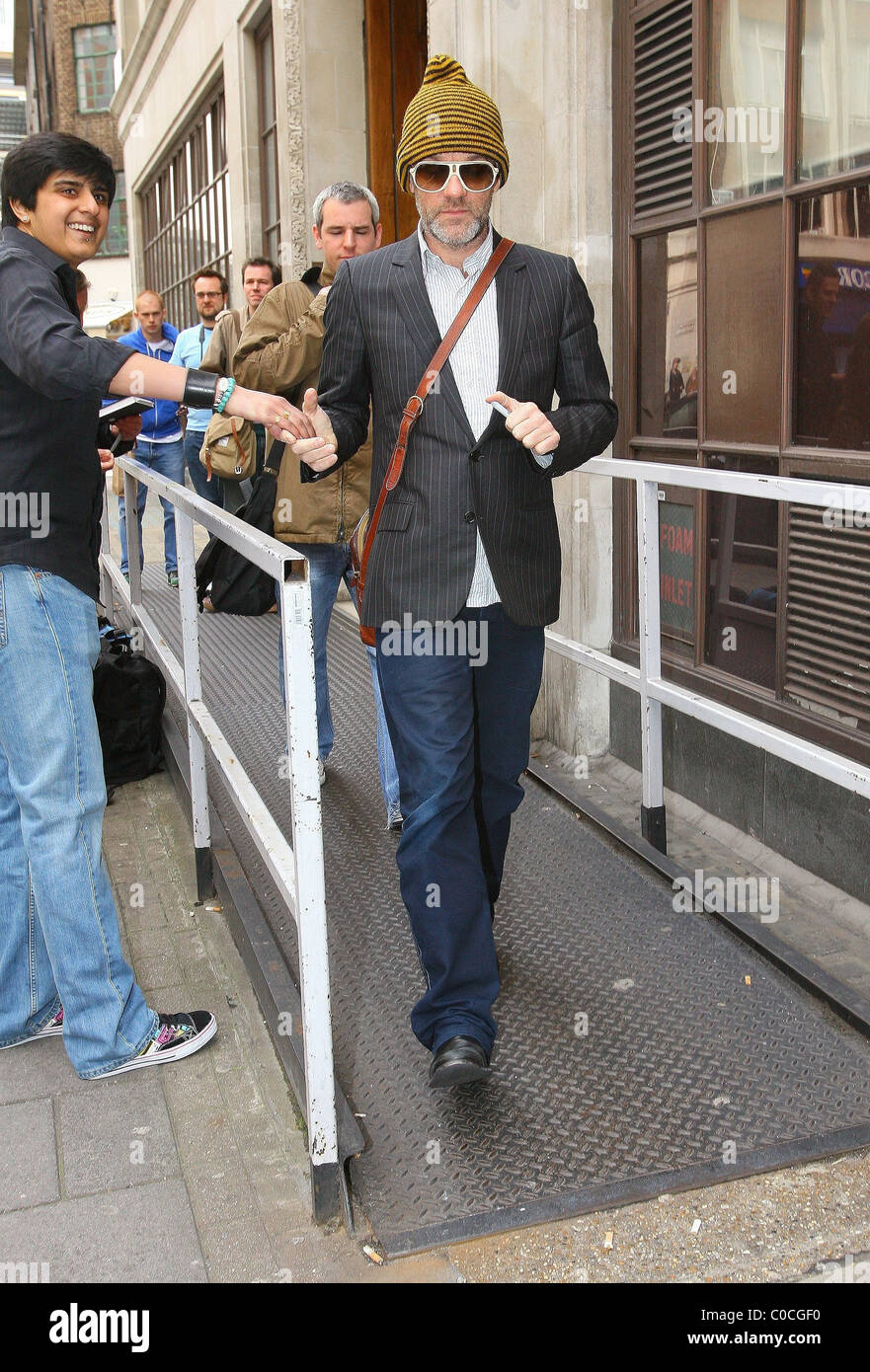 Michael Stipe of REM leaving Radio 1 studios and shaking a fan's hand ...