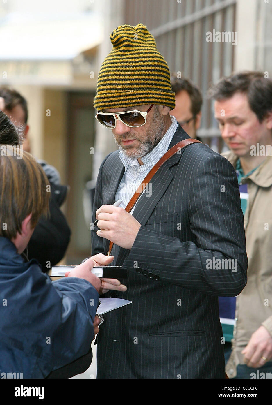 Michael Stipe of REM leaving Radio 1 studios and signing autographs for ...