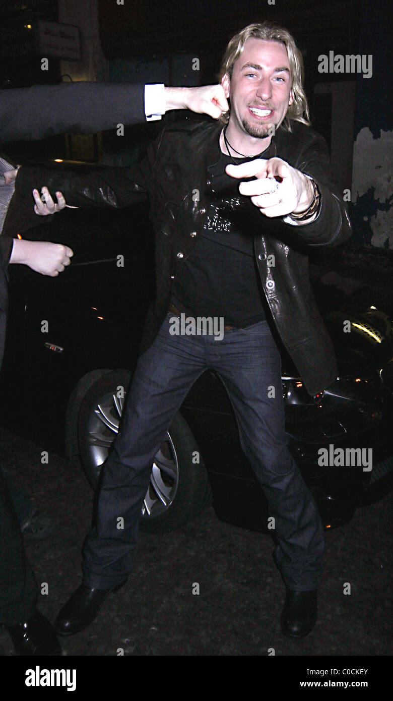 Chad Kroeger of Nickelback play fights with a friend outside Boujis and ...