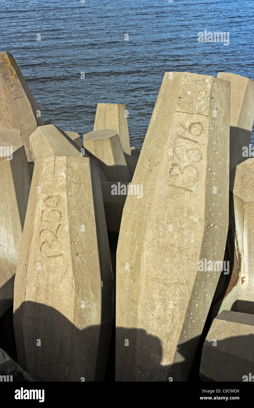 Numbered pre-cast concrete sections forming a defence against the tide ...