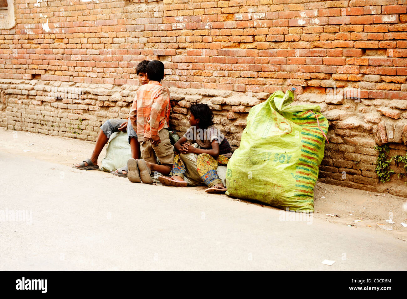 children collecting plastic bottles for recycling , peoples lives ( the ...