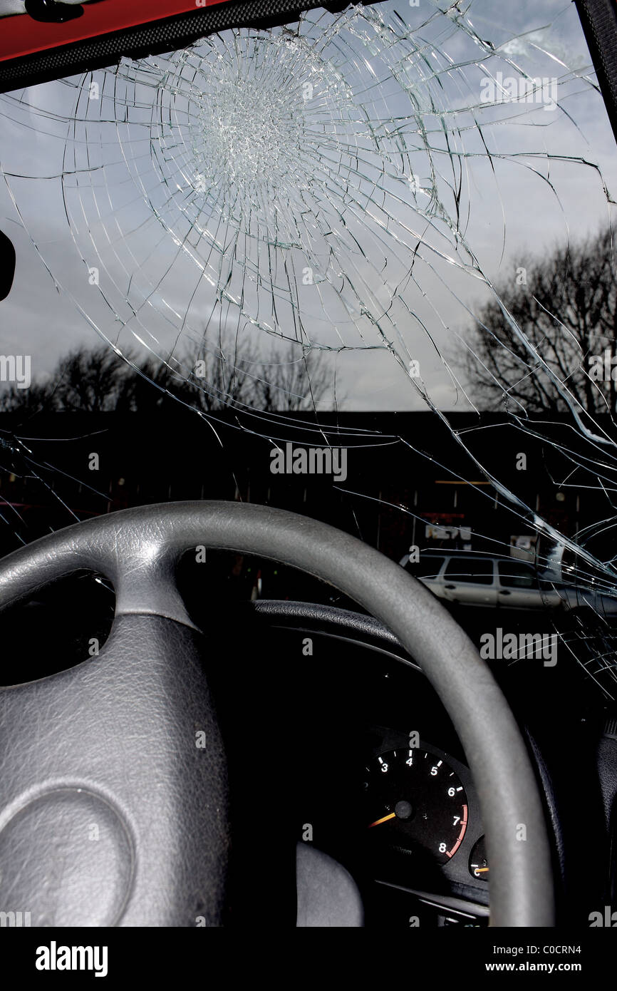 car accident where the window has smashed and caused damage Stock Photo ...