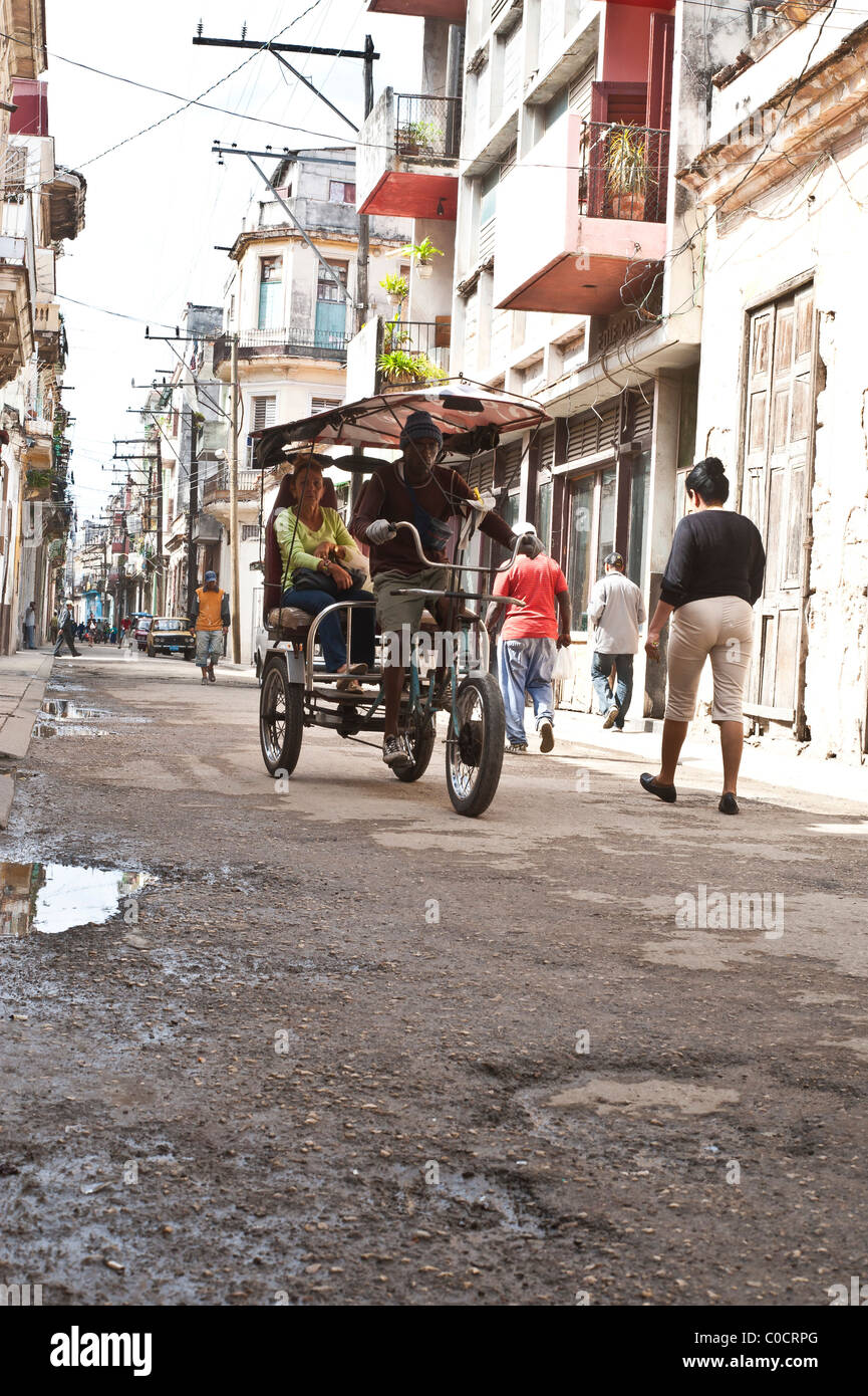Typical back street scene with bicycle taxi Old Havana Cuba Stock Photo ...