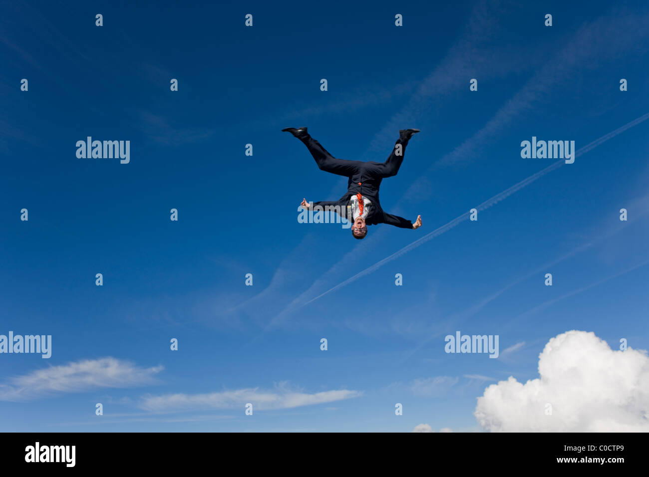 Man in business suit is going to work by jumping out of a plane and ...
