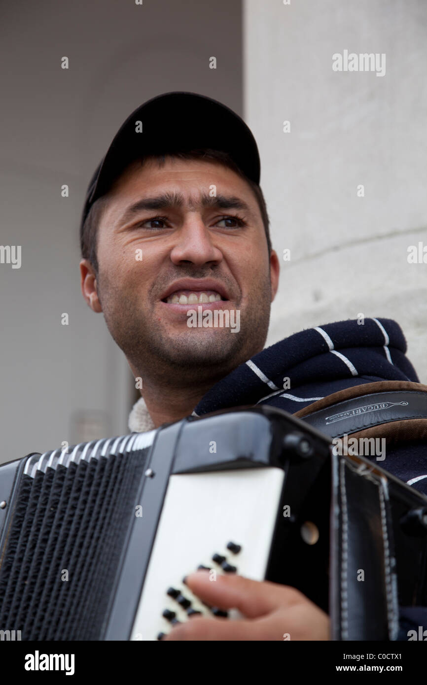 Man musician playing accordion busking hi-res stock photography and ...