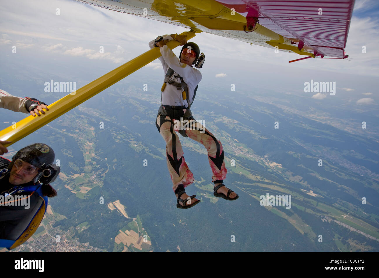 Skydiver is holding on wing of plane before he is jumping off it Stock ...