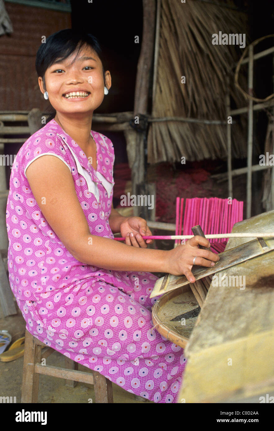 Elk134-4177 Vietnam, Mekong River delta, young woman rolling incense ...