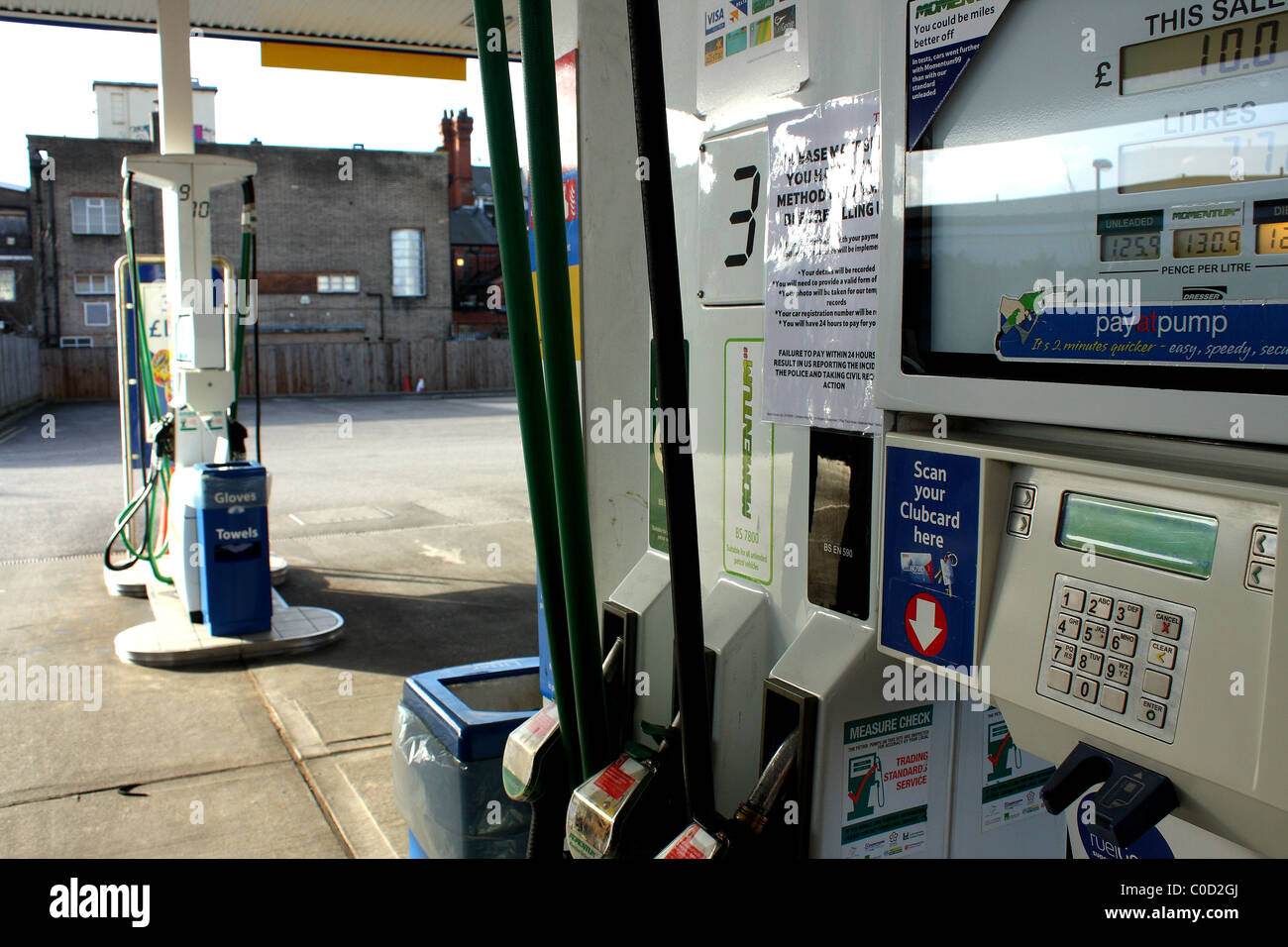 An empty petrol station forecourt with unleaded and diesel fuel closed ...