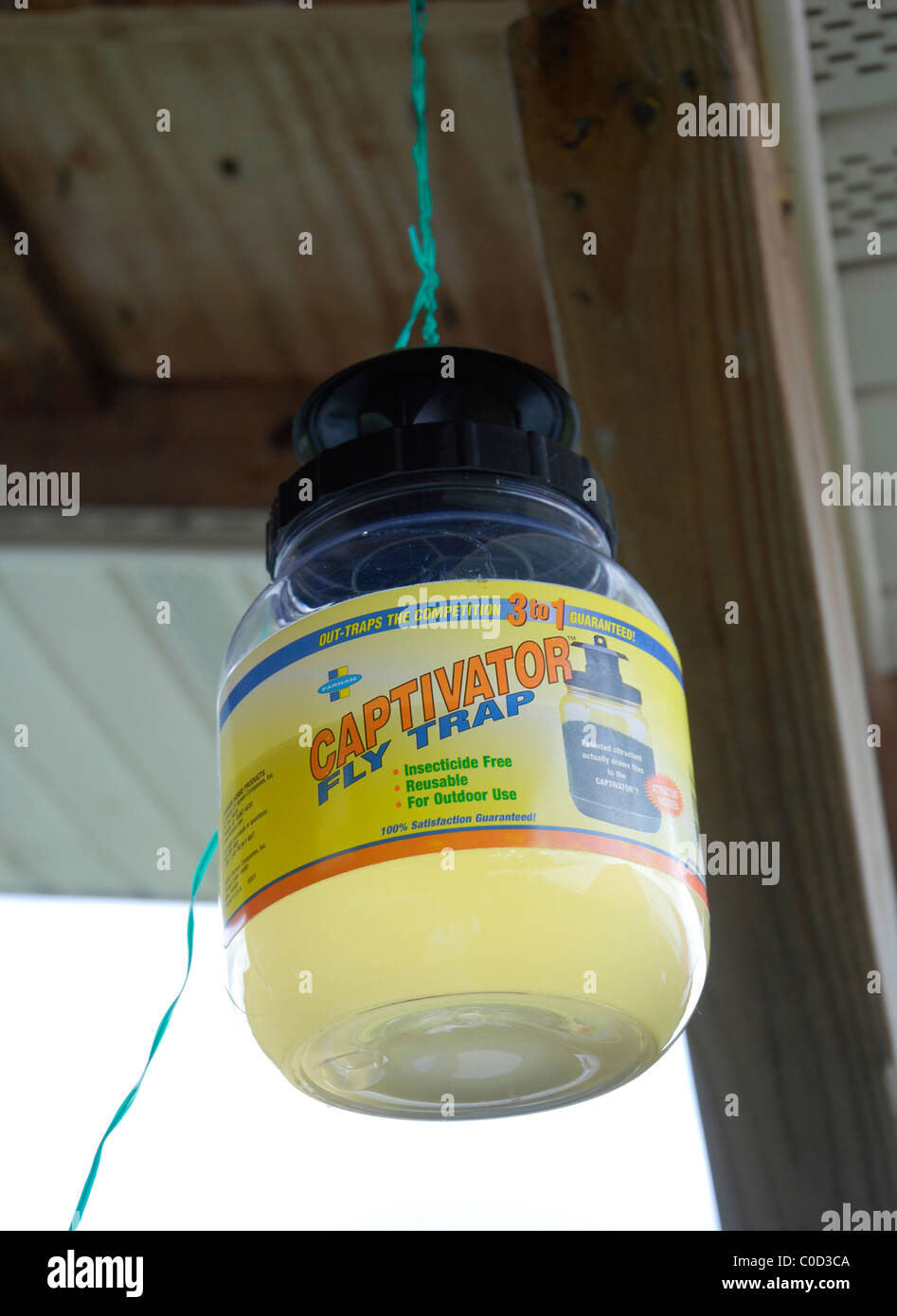 fly trap hangs outside of barn North Florida Stock Photo - Alamy