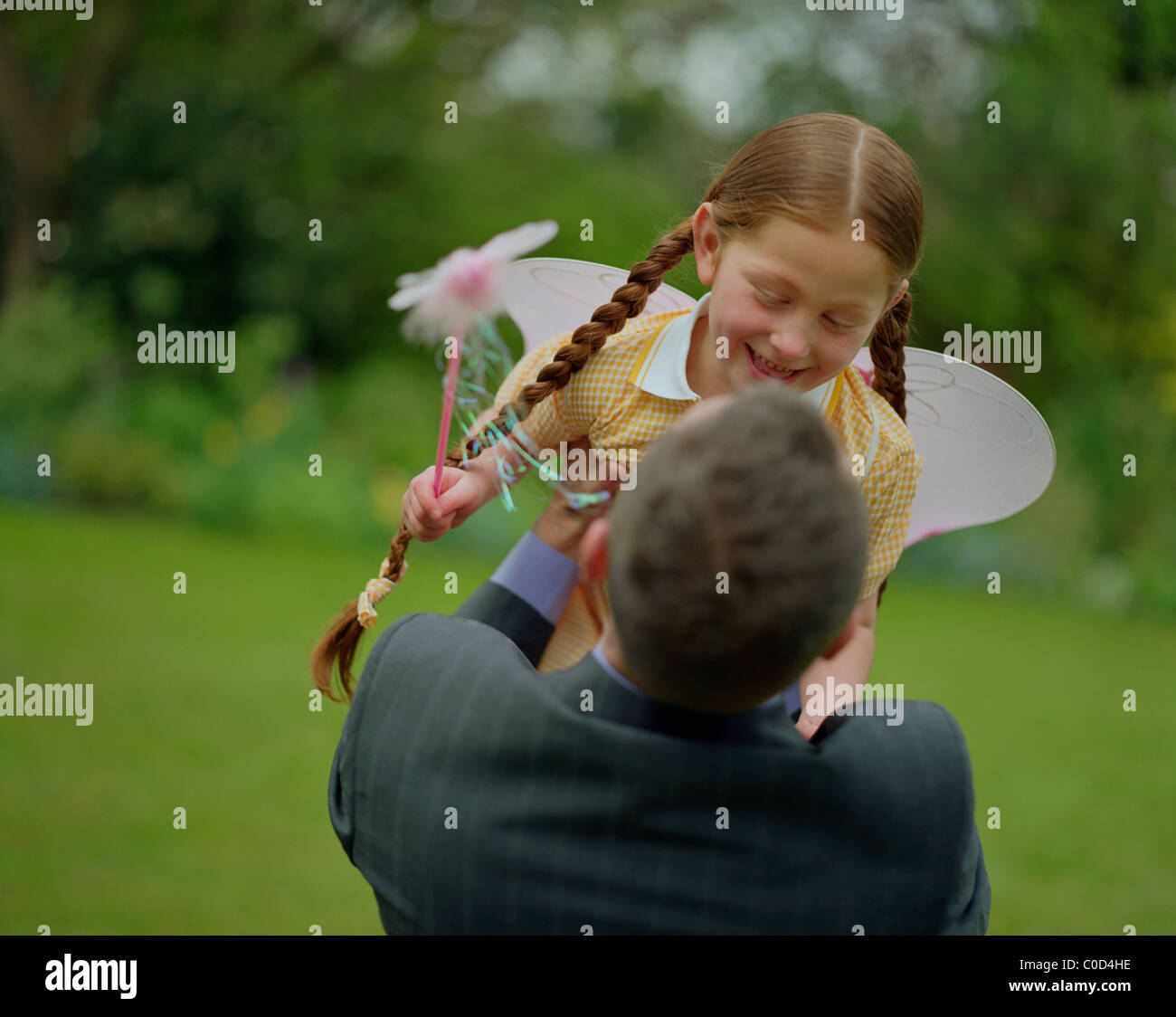 Father and daughter wearing fairy wings Stock Photo - Alamy