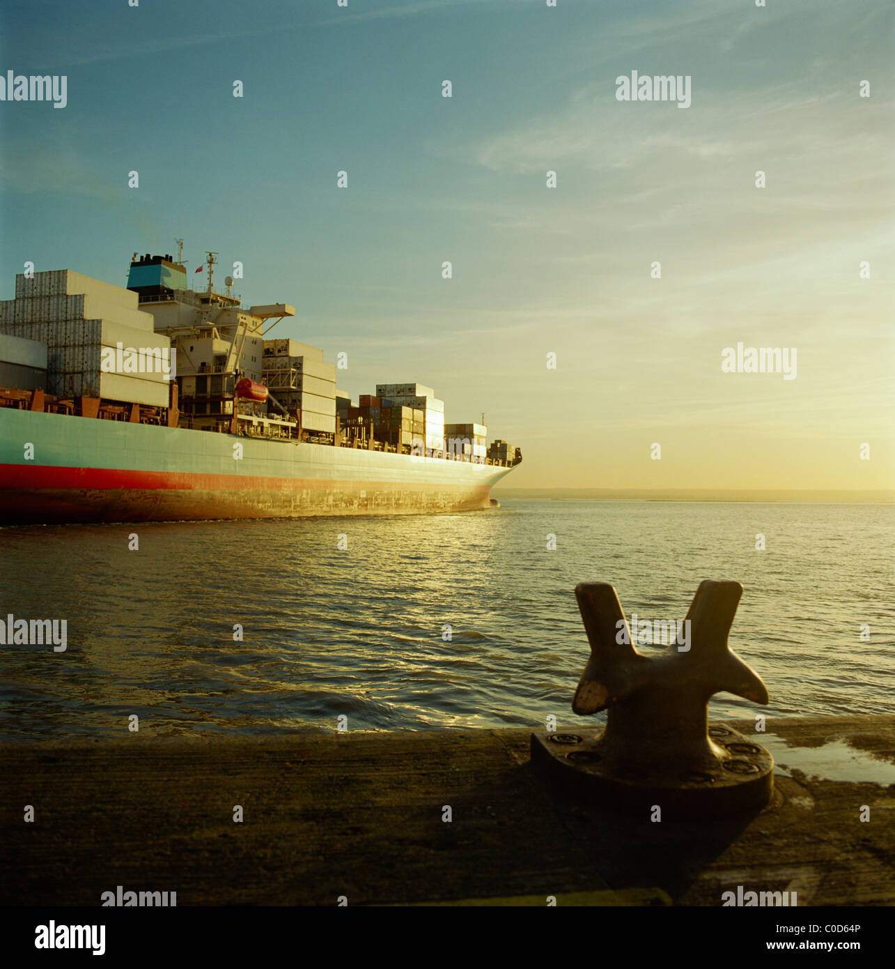 A container ship leaving the harbor fully loaded Stock Photo - Alamy