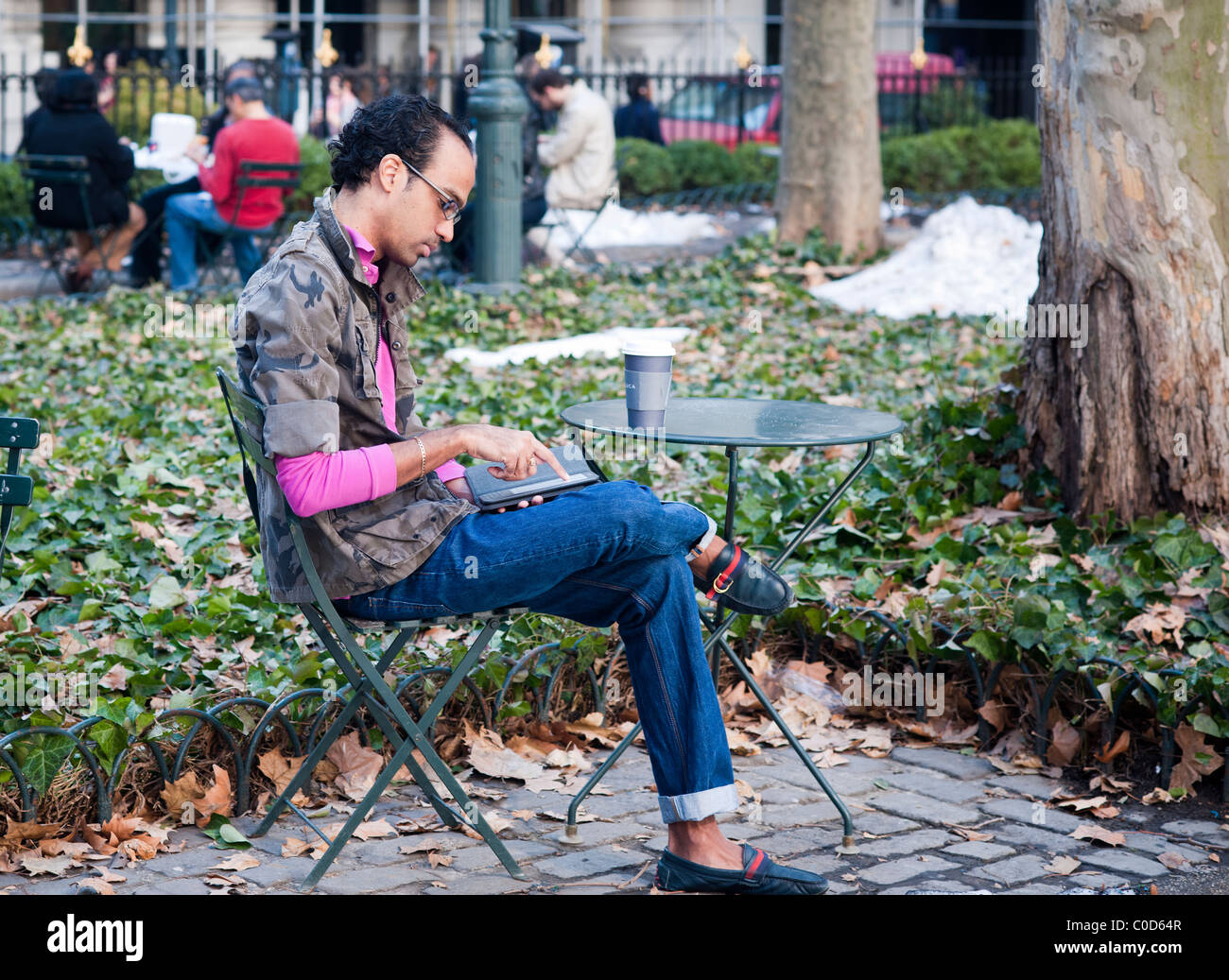 A reader uses his Amazon Kindle electronic book in Bryant Park in New ...