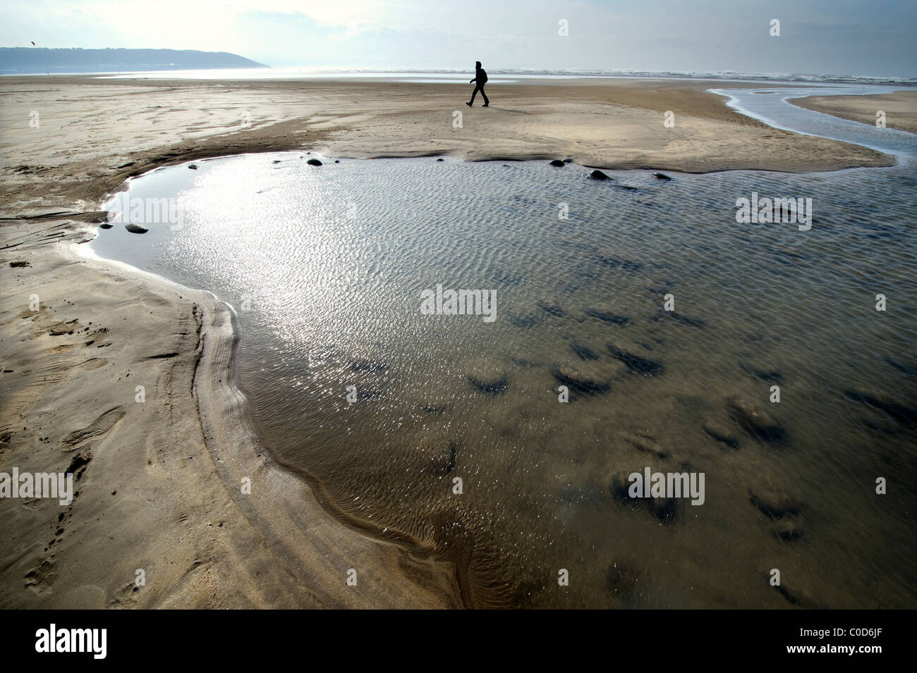 a walker enjoys Northam Burrows on the North devon coast Stock Photo ...